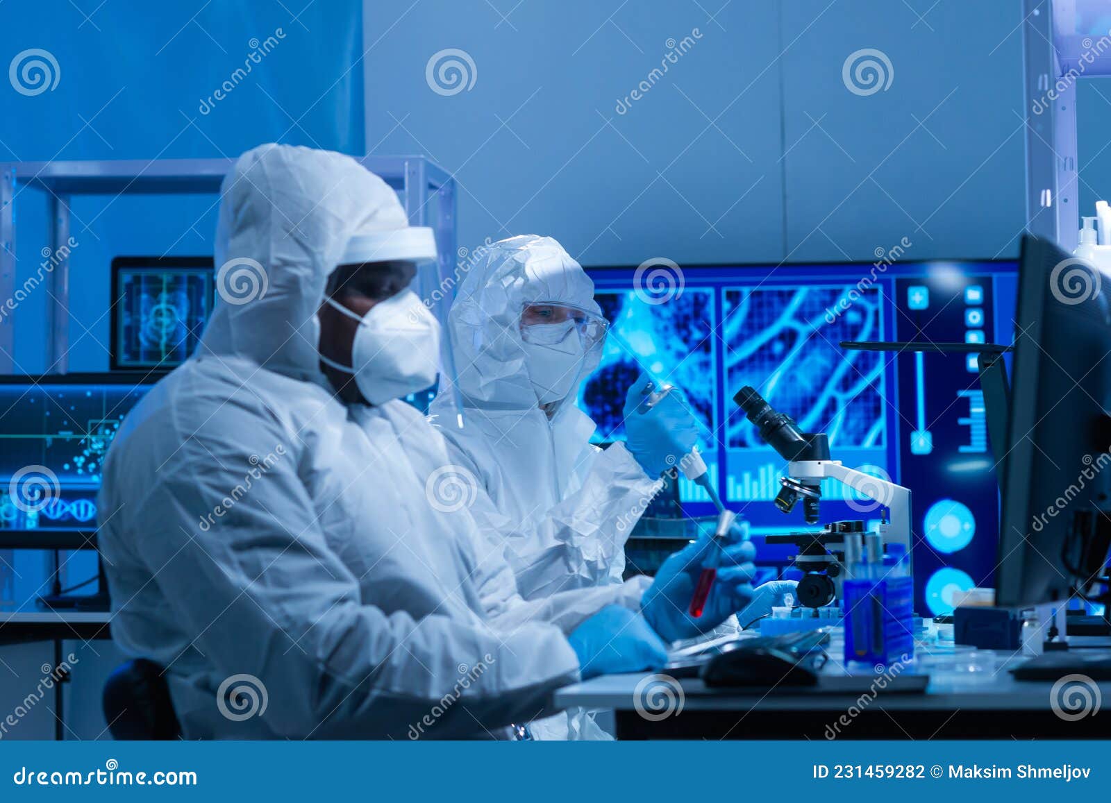 African-american Doctor in Protective Suit is Doing a Science ...