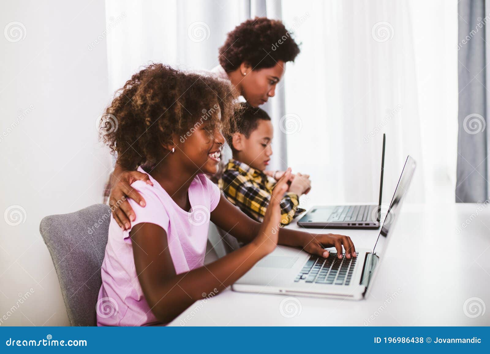 African American Elementary Students Using Computer and Following ...