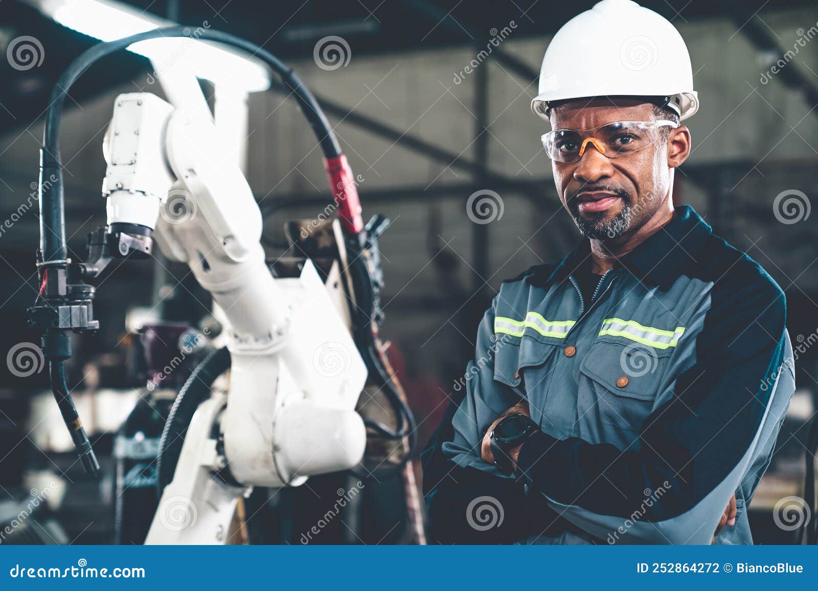 African American Factory Worker Working with Adept Robotic Arm Stock ...