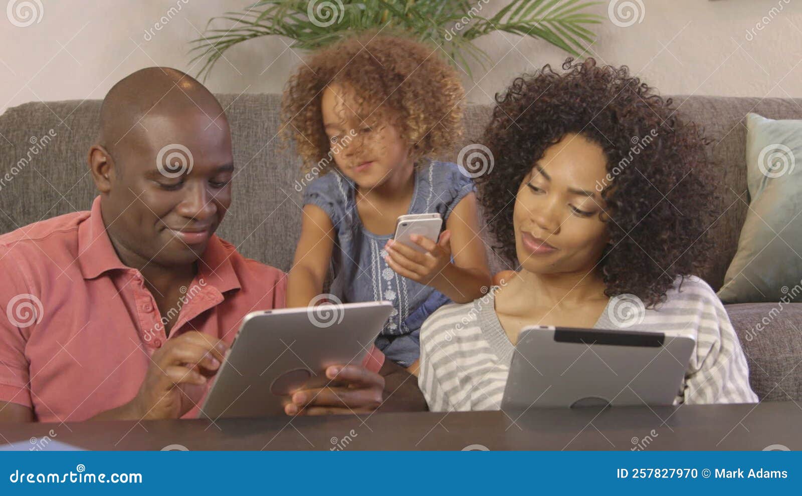 African American Family Using Cellphone and Tablets Stock Footage ...