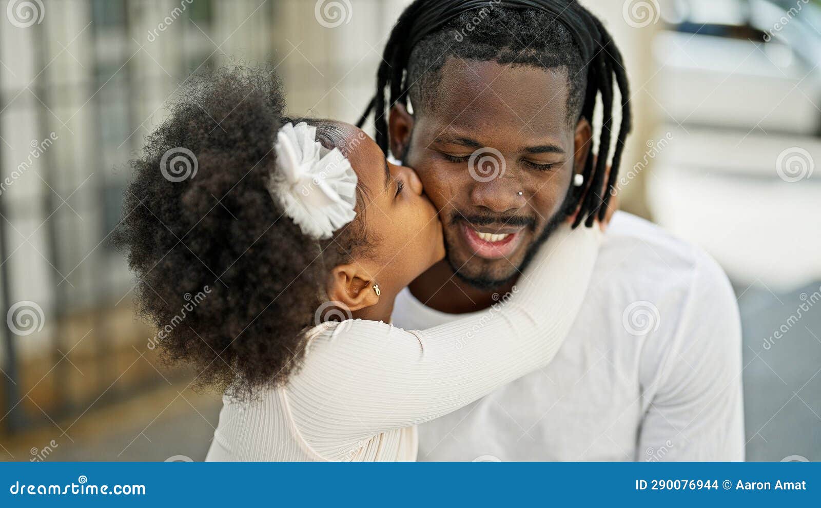 African American Father And Daughter Smiling Confident Hugging Each