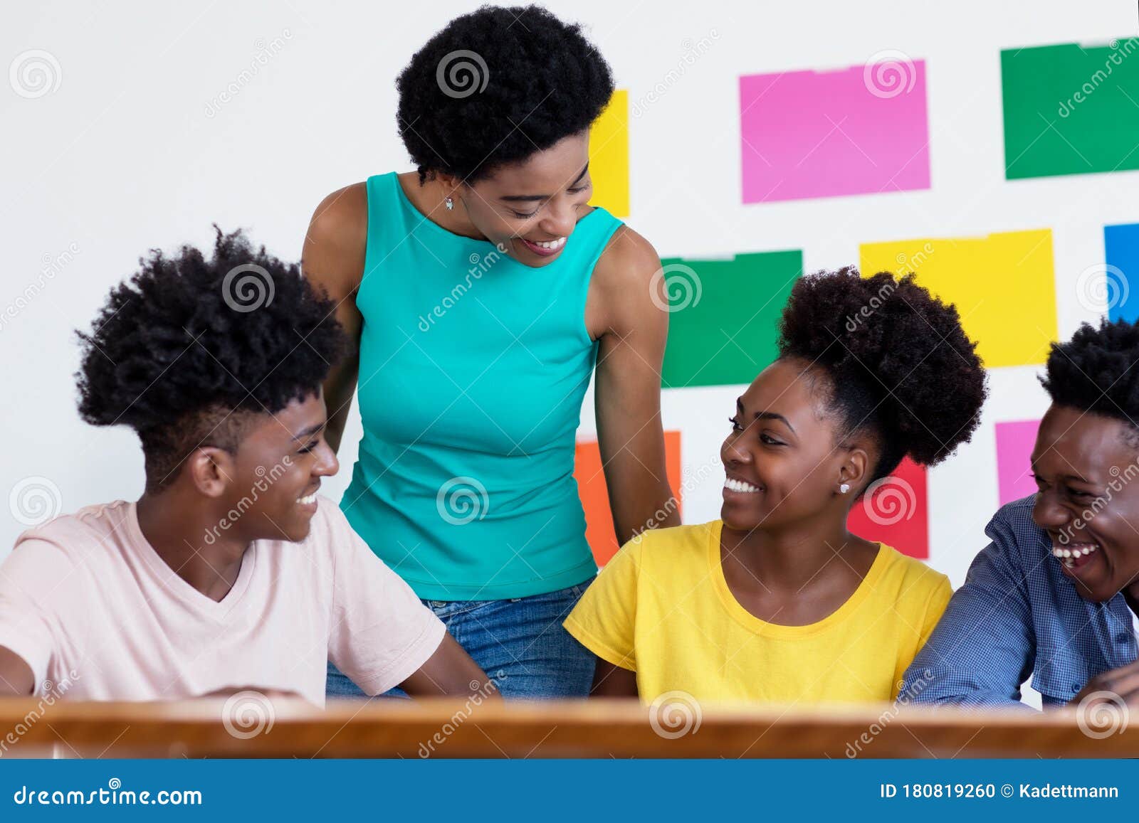 African American Female Professor Learning with Students Stock Photo ...