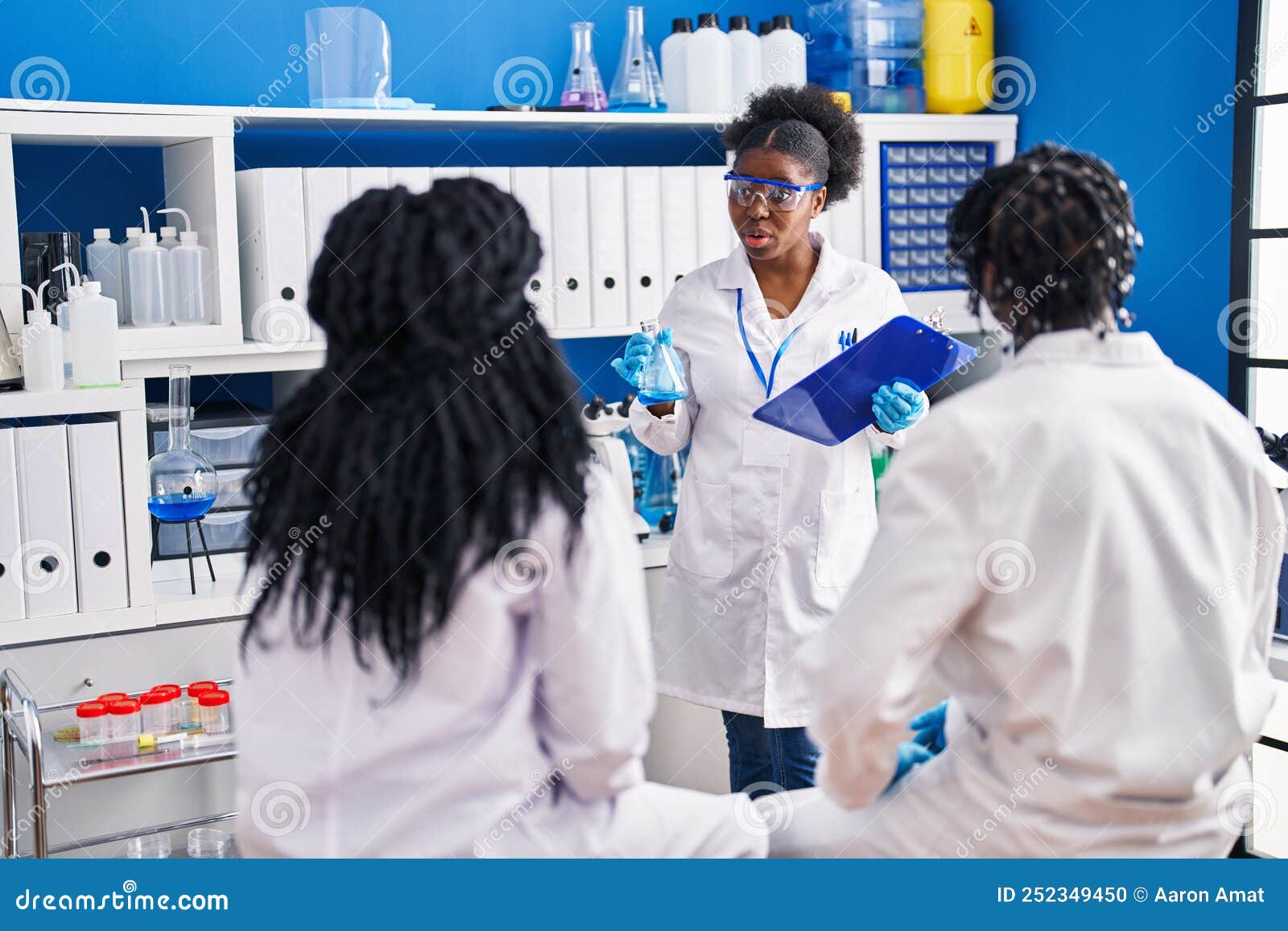 African American Friends Scientists Explaining Experiment at Laboratory ...