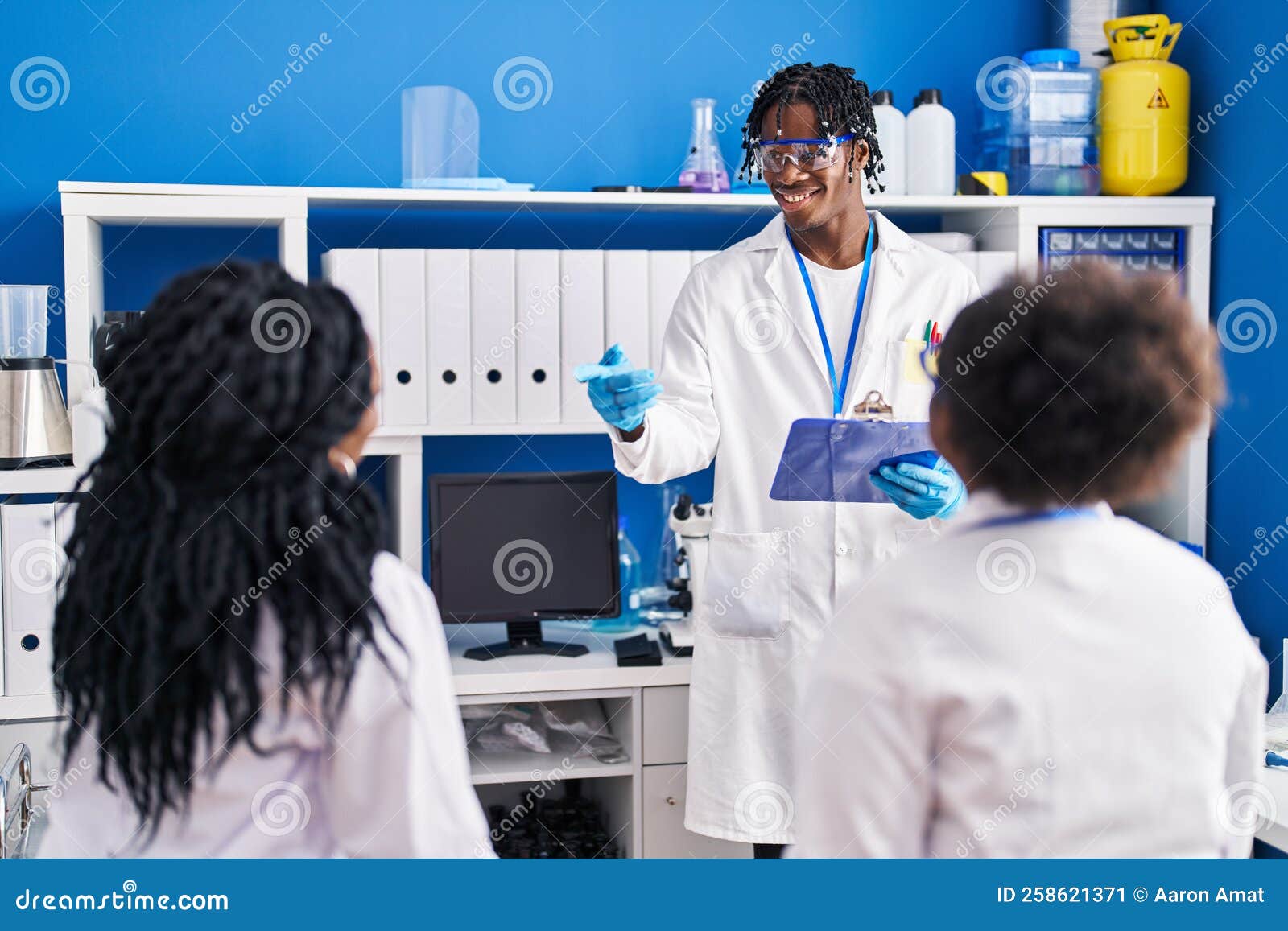 African American Friends Scientists Explaining Experiment at Laboratory ...