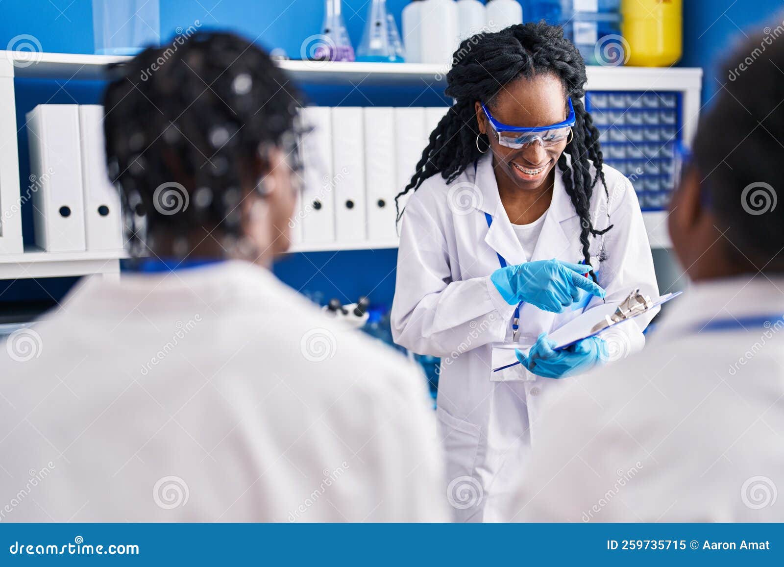 African American Friends Scientists Explaining Experiment at Laboratory ...