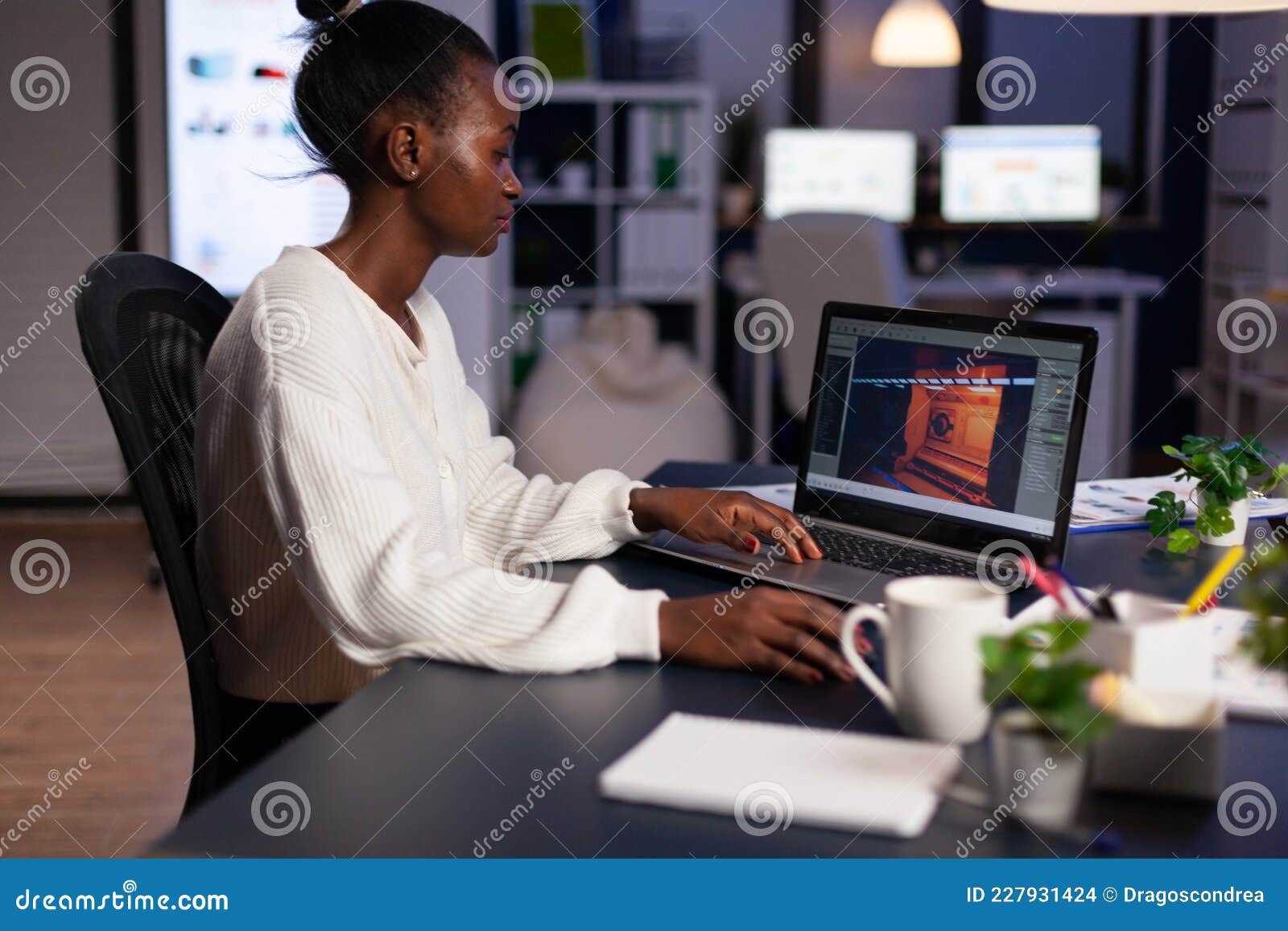 African American Game Developer Testing New Game Working Late at Night ...