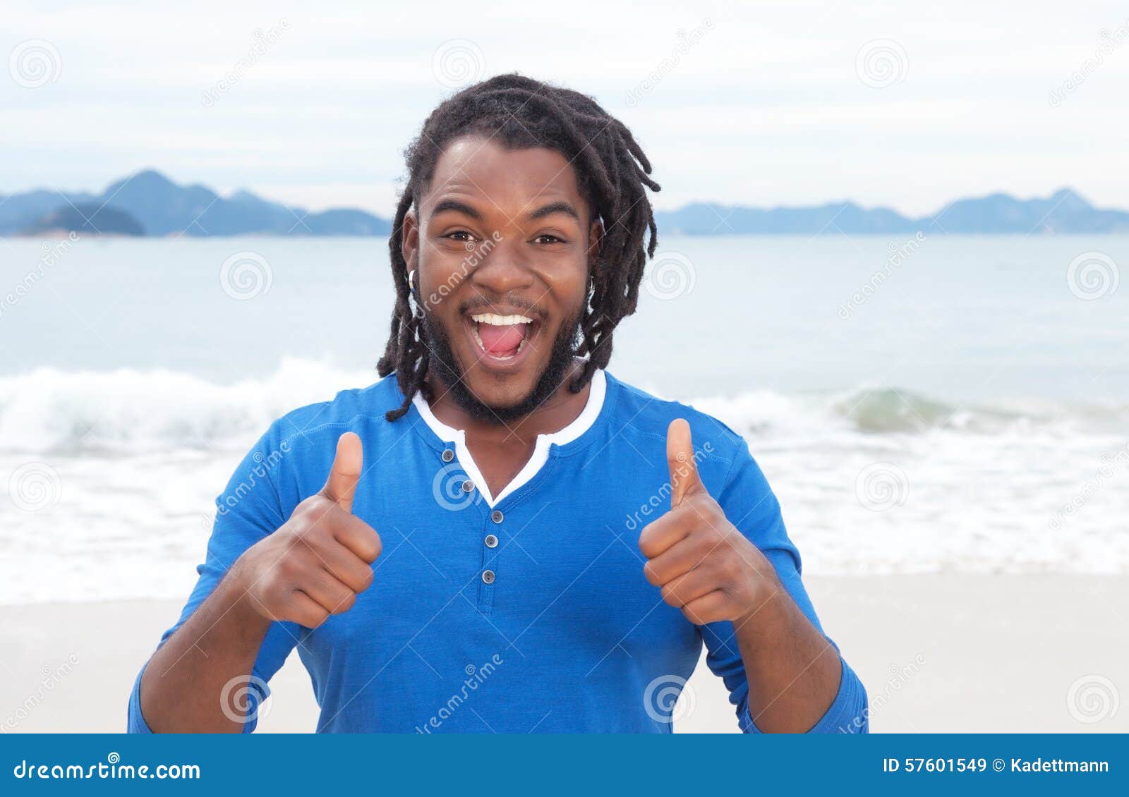 African American Guy with Dreadlocks at Beach Showing Both Thumbs Stock ...