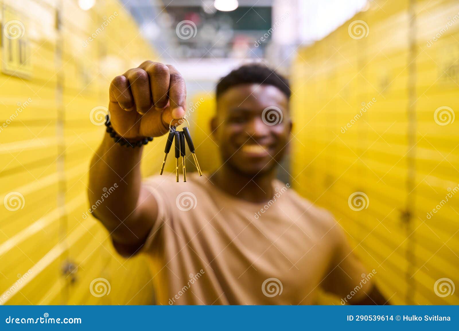 African American Guy Stands with Keys at Storage Containers Stock Photo ...