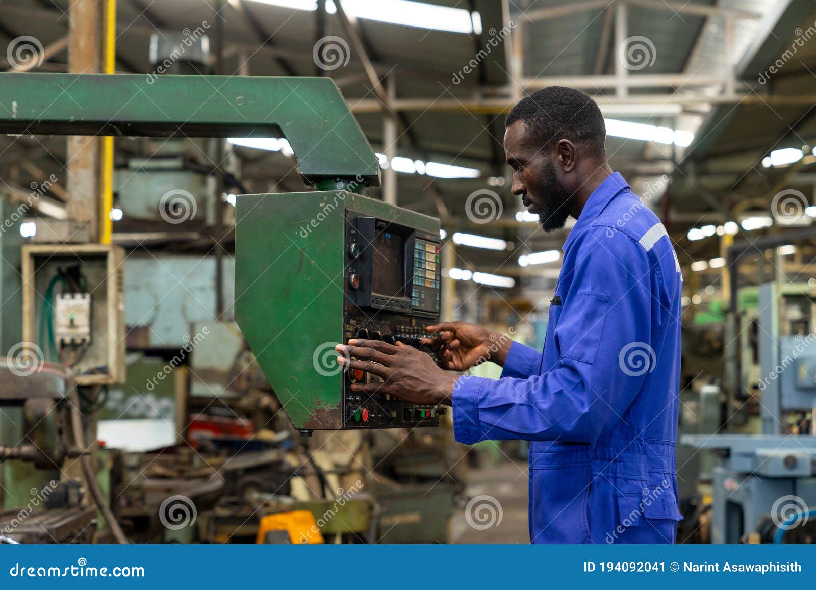 African American Industry Worker Control Machines in the Workplace on a ...