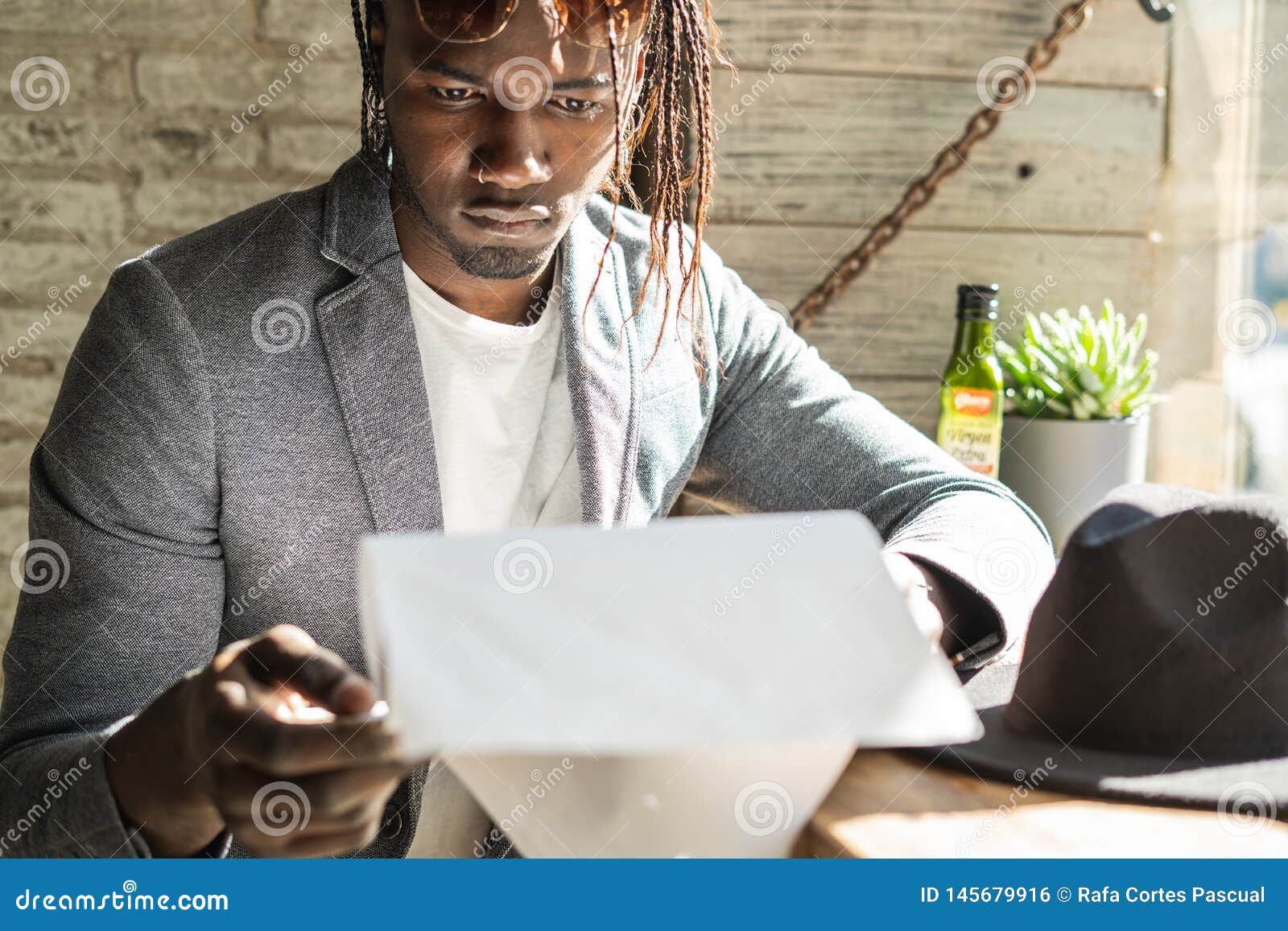 African American Looking at a Restaurant Menu Stock Photo - Image of ...