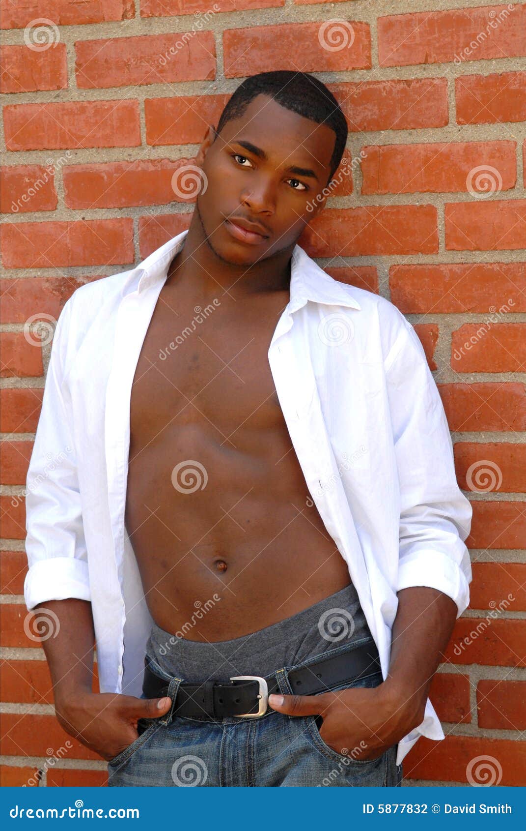 African American Male Standing Against a Wall Stock Photo - Image of ...