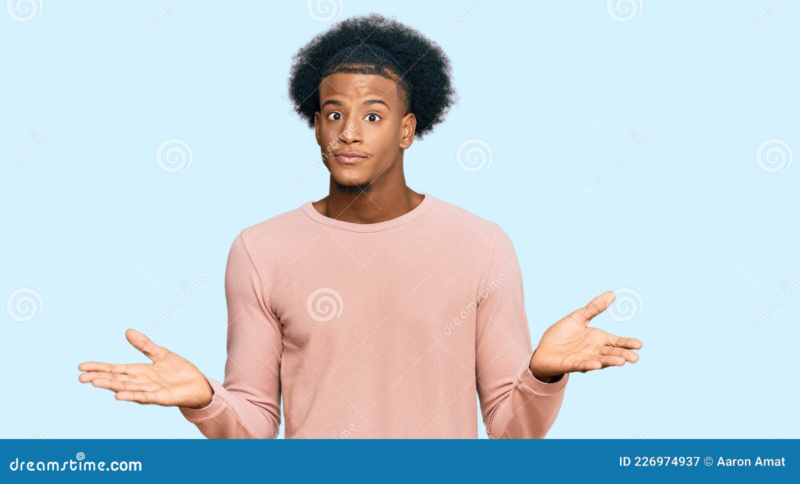 African American Man With Afro Hair Wearing Casual Clothes Clueless And