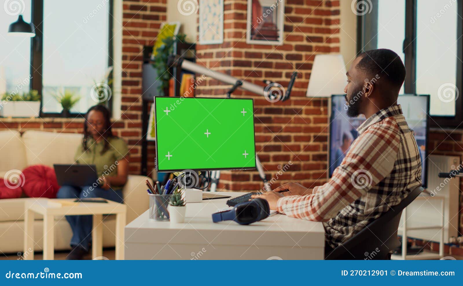 African American Man Analyzing Greenscreen Display on Computer Stock ...