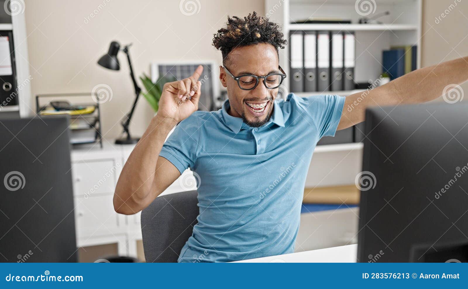 African American Man Business Worker Using Computer Dancing at Office ...