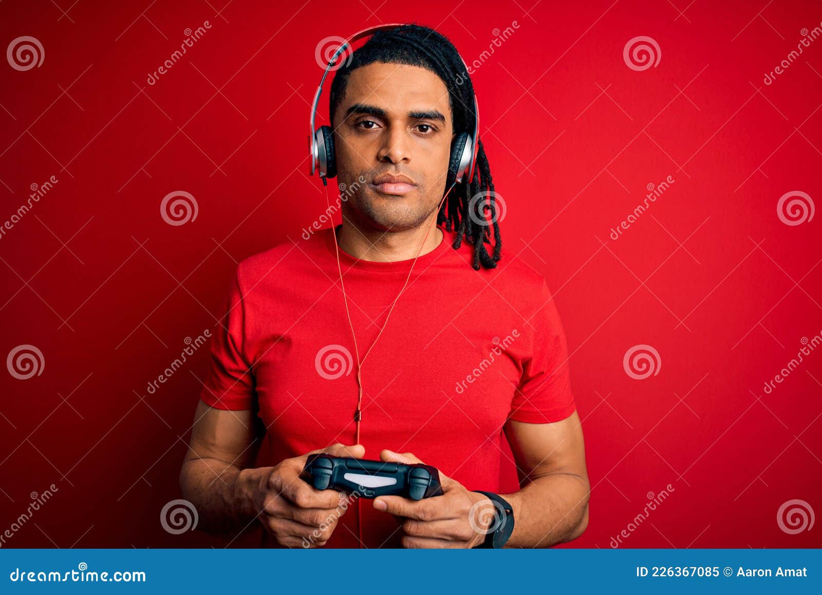 African American Man with Dreadlocks Playing Video Game Using Joystick ...