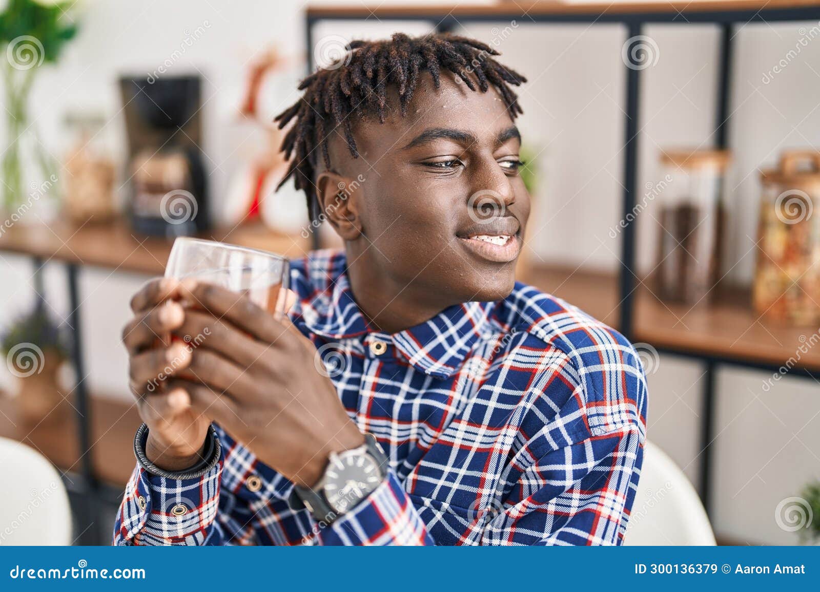 African American Man Drinking Tea Sitting on Table at Home Stock Image ...
