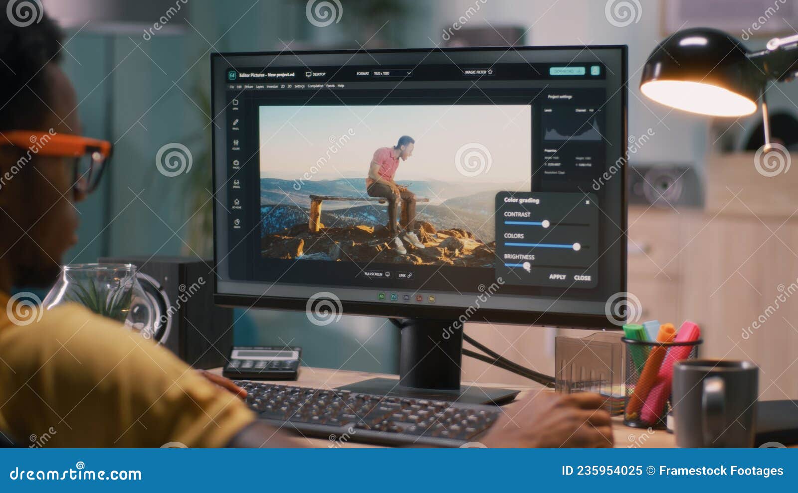 African American Man Editing Video with Chromakey Background Stock ...
