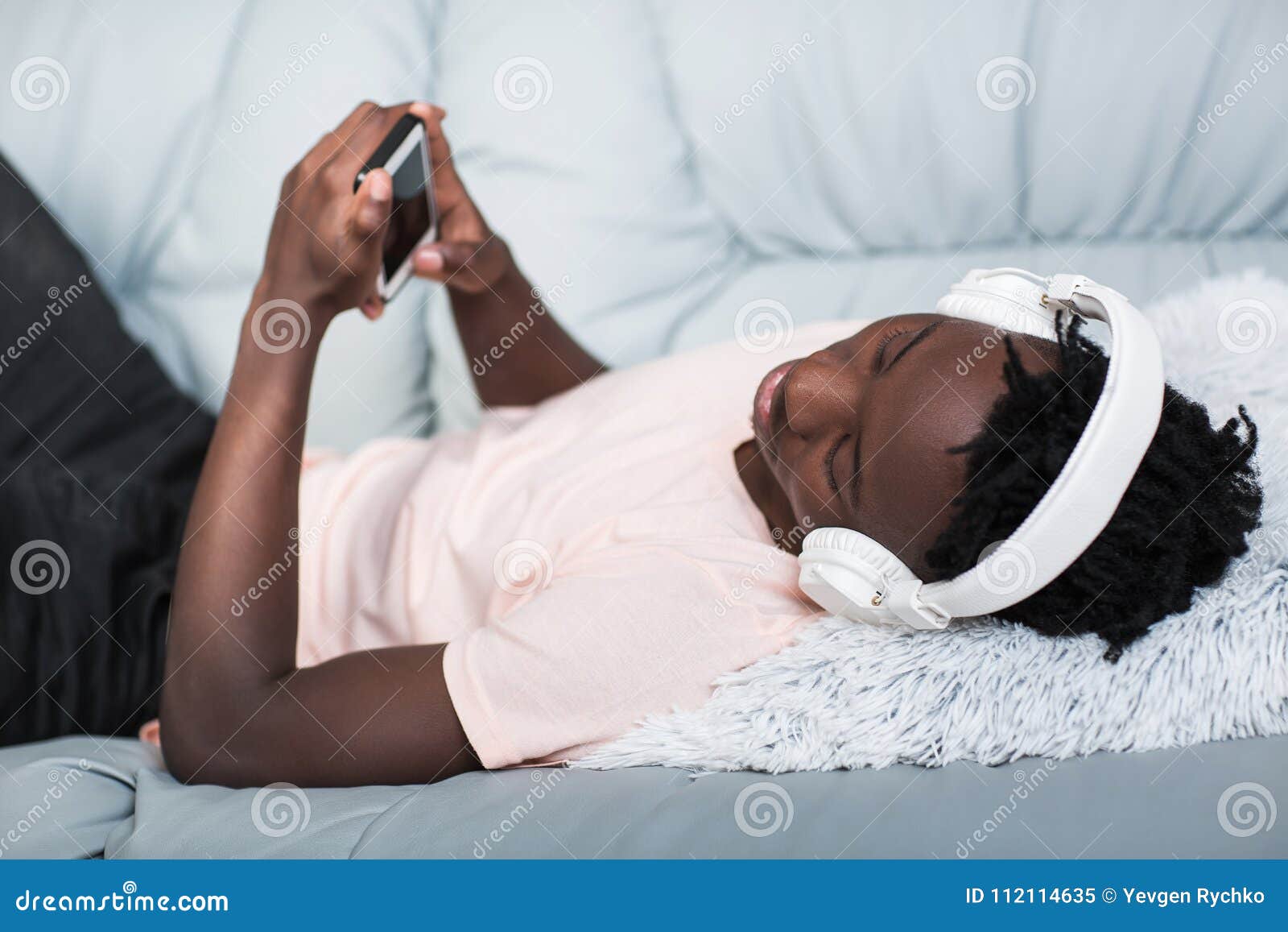 African American Man In Headphones Listening To Music Stock Image