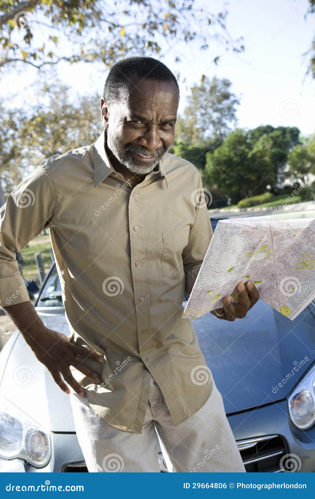 African American Man Holding Map Stock Photo - Image of shirt, mature ...
