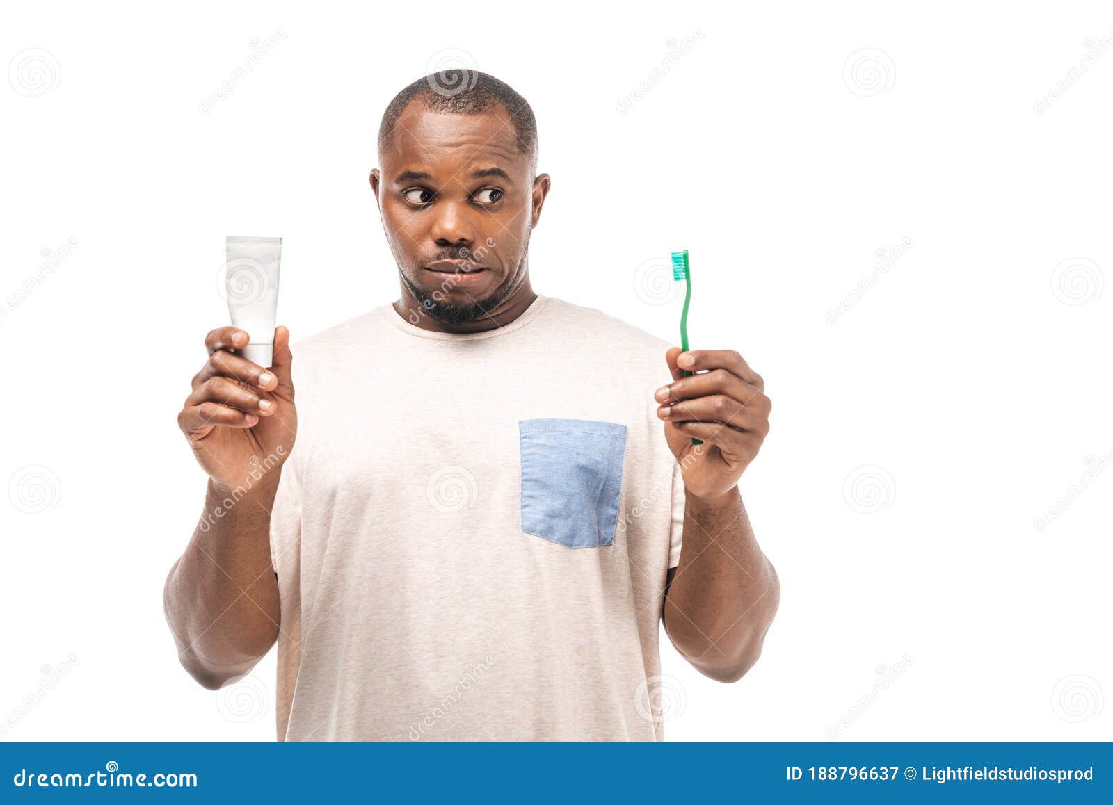 African American Man Holding Toothbrush and Toothpaste Isolated on ...