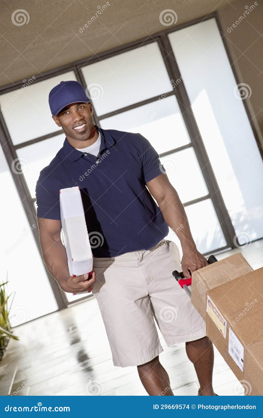 African American Man with Packages To Deliver Stock Photo - Image of ...