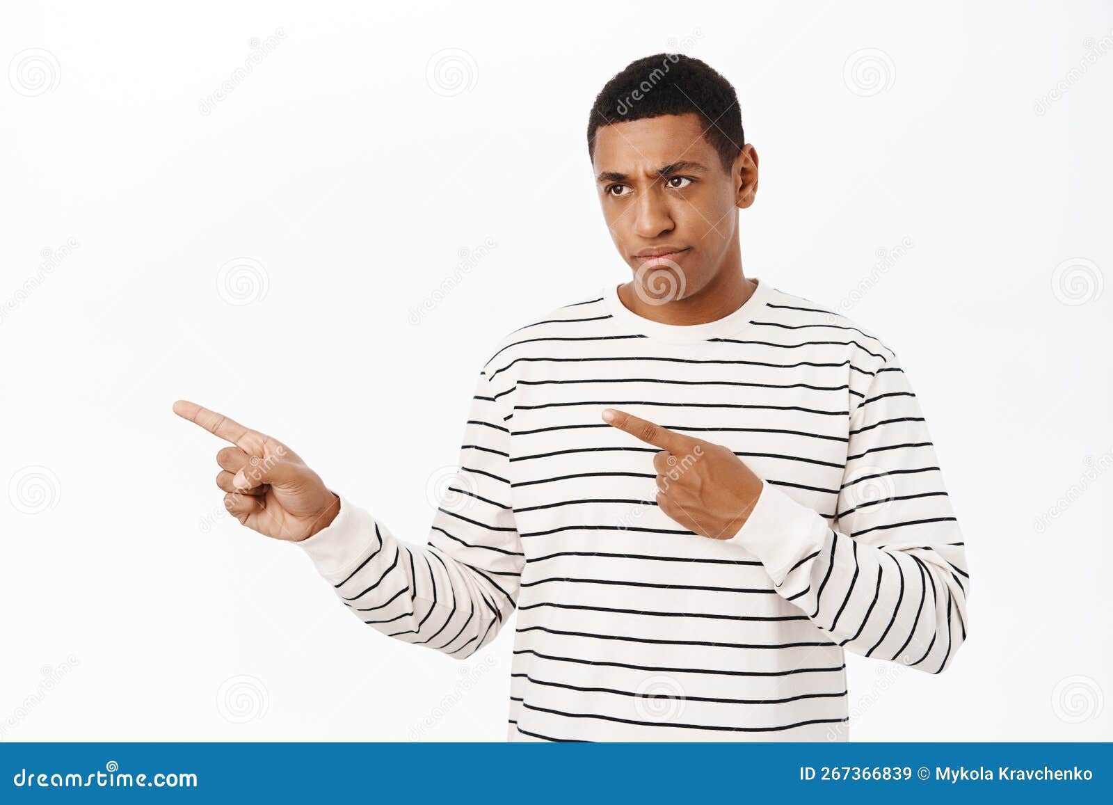 African American Man Pointing and Looking Left with Disappointing Look ...