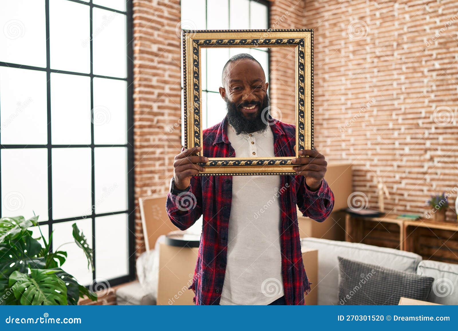 African American Man Putting Face in Empty Frame Winking Looking at the ...