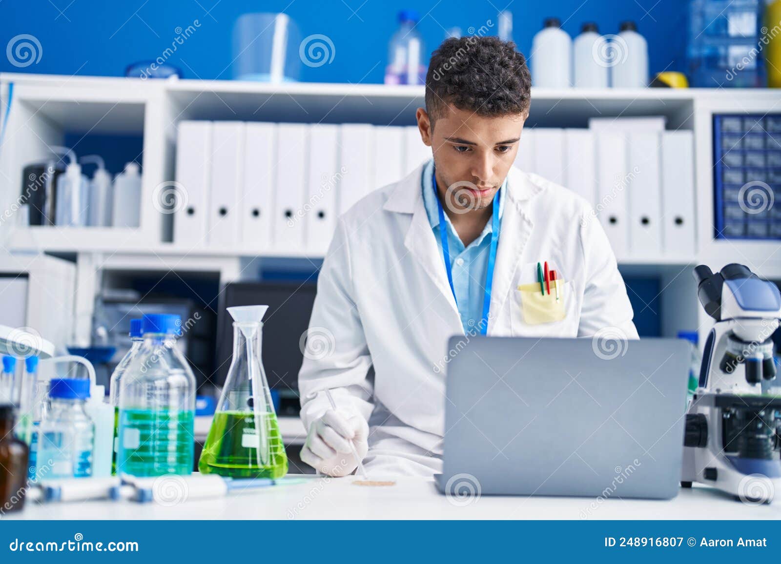African American Man Scientist Using Laptop Working at Laboratory Stock ...