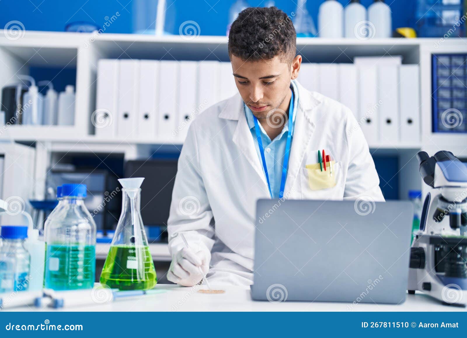 African American Man Scientist Using Laptop Working at Laboratory Stock ...