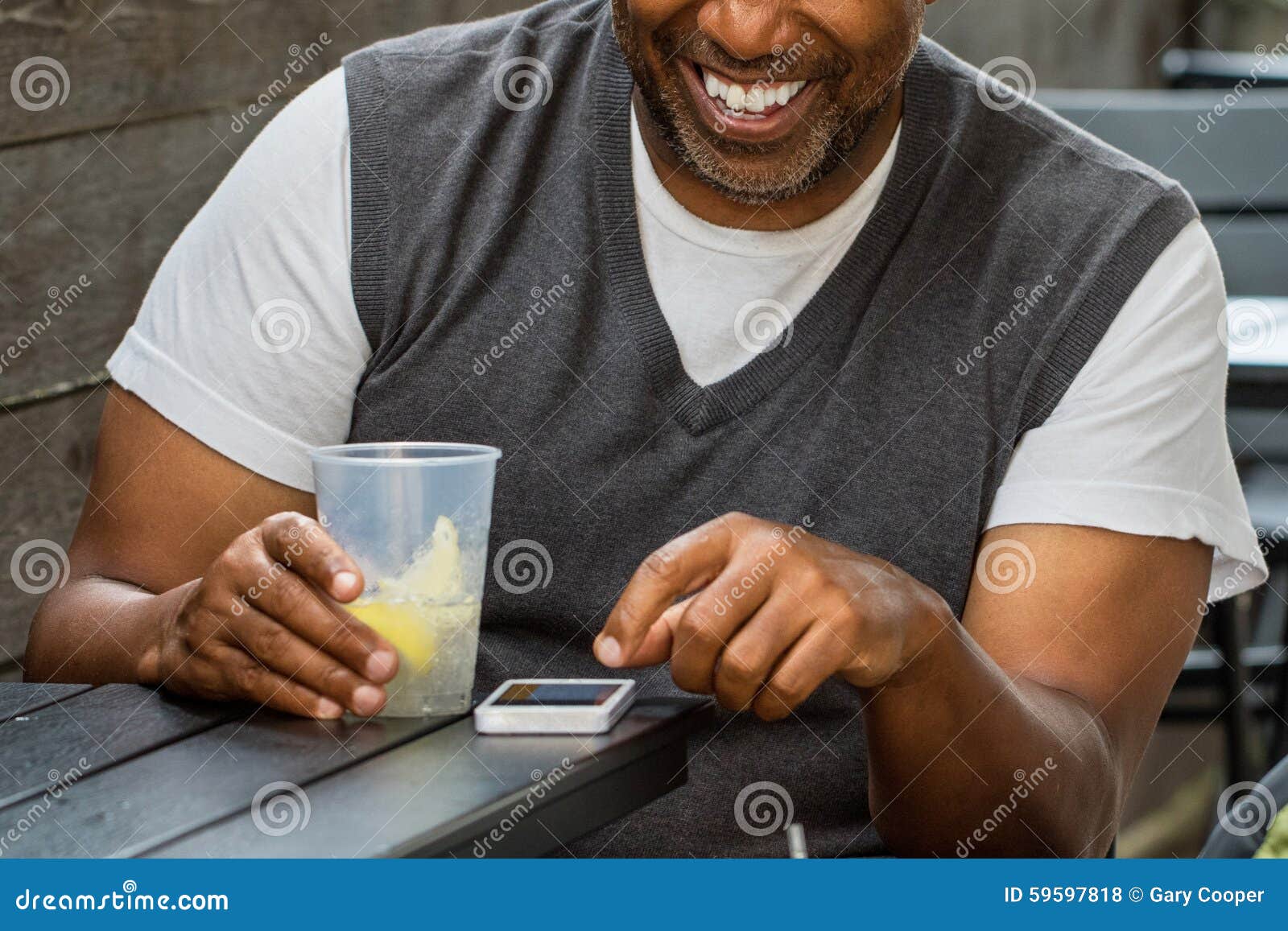 African American Man Texting Stock Photo - Image of cheerful, group ...