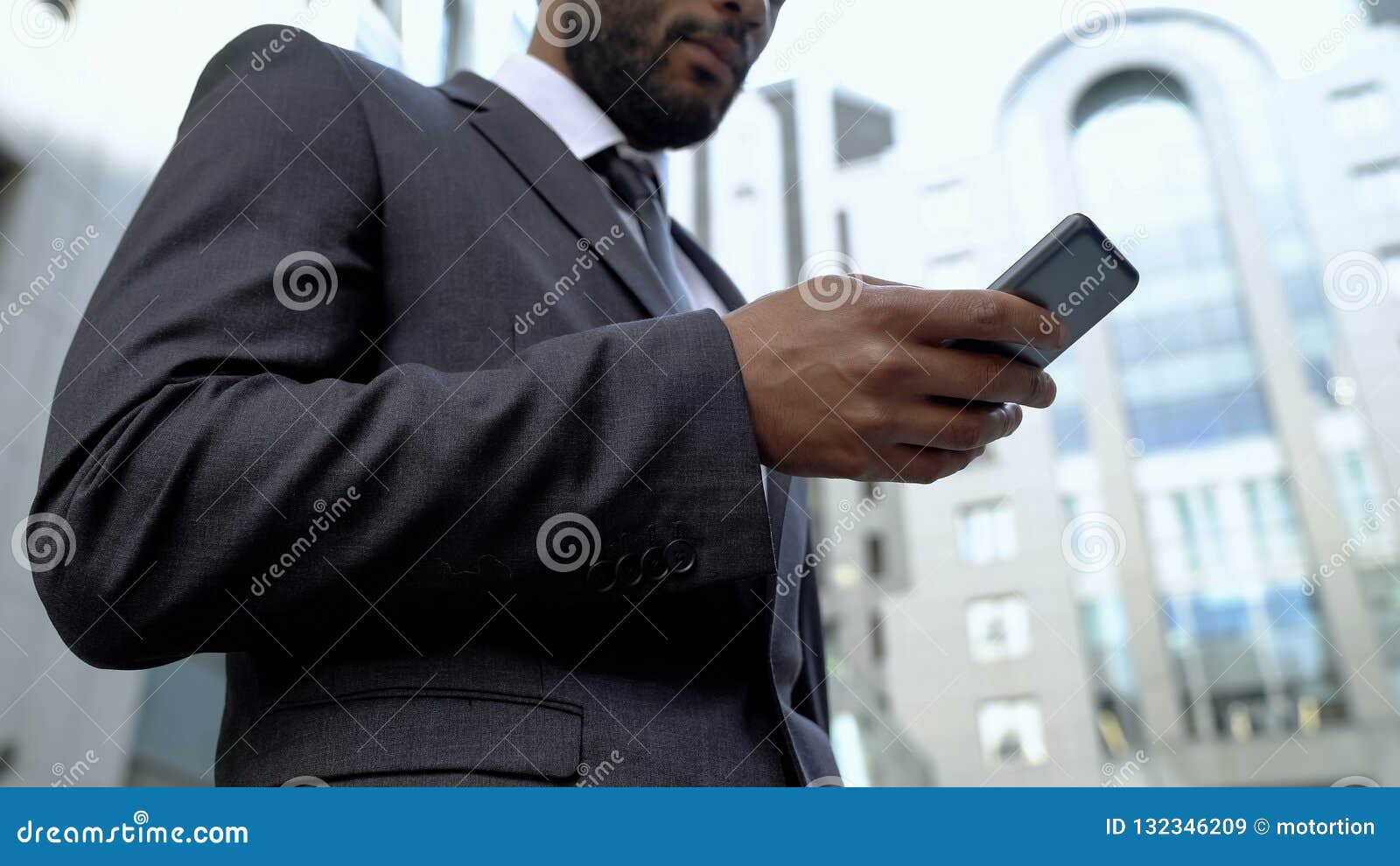 African American Man Using Smartphone for Quick Access Information ...