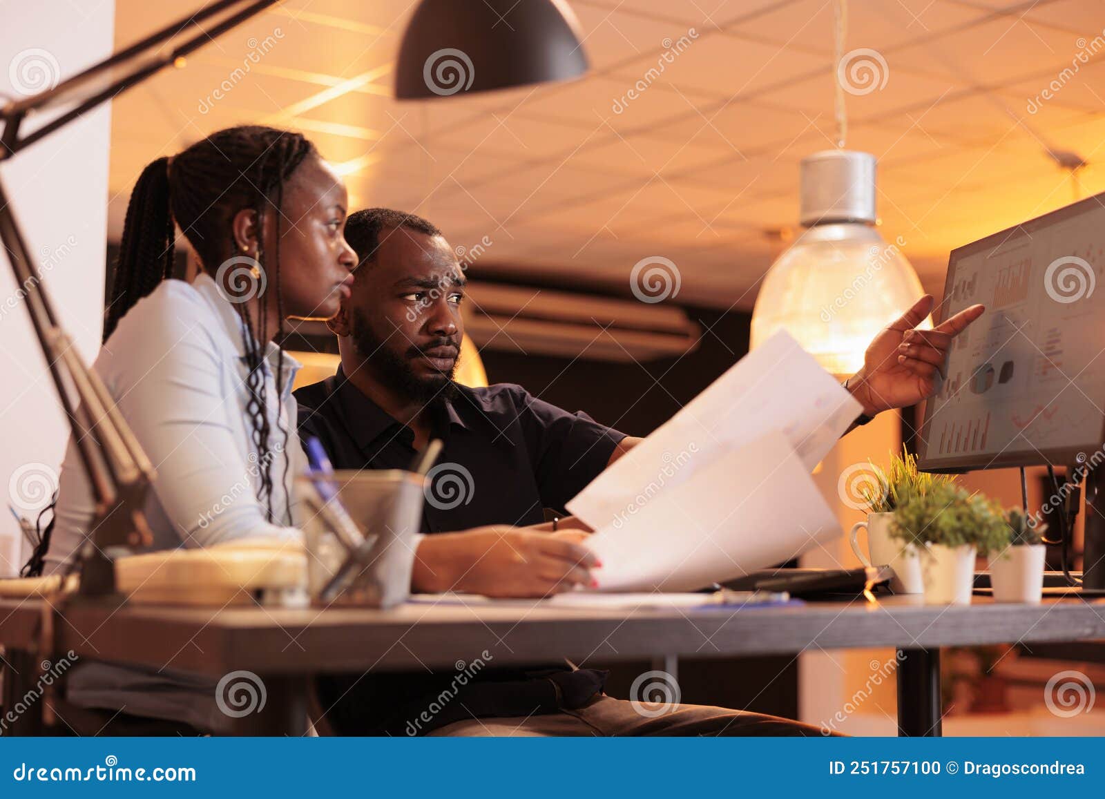 African American Man and Woman Doing Teamwork Collaboration Stock Photo ...