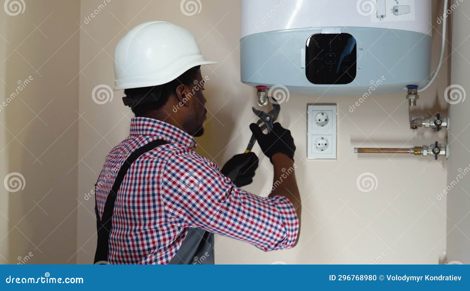 African American Plumber Installing a Boiler Stock Footage - Video of ...