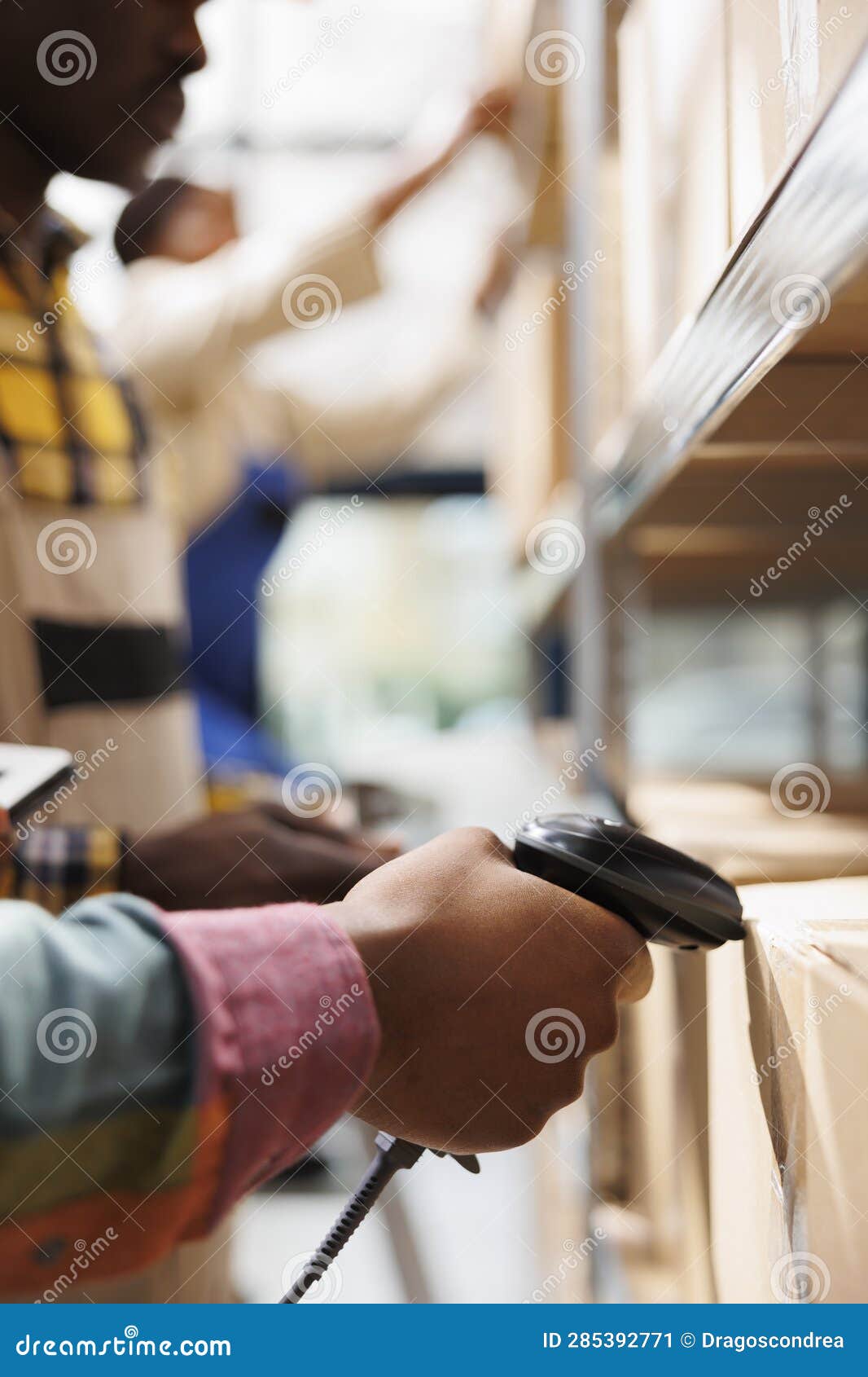 African American Postal Worker Hand Scanning Parcel in Warehouse Stock ...