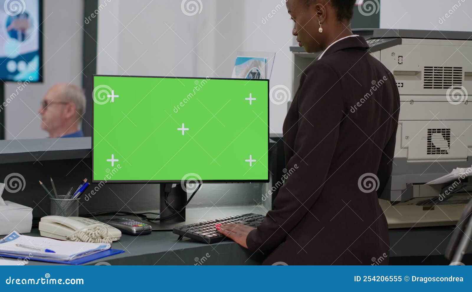 African American Receptionist Using Greenscreen on Computer Stock Video ...