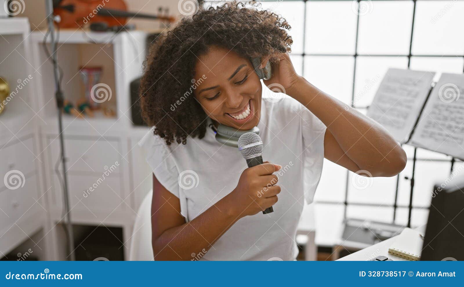 African American Singer with Braids Performing in a Music Studio Stock ...