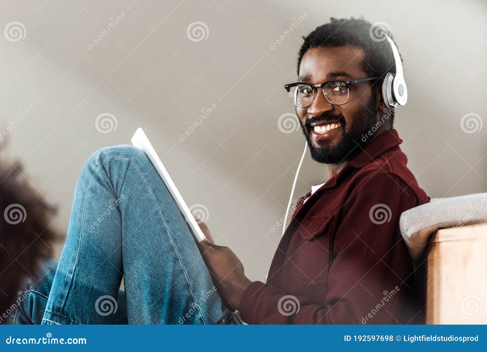 American Student in Headphones Using Digital Tablet in University Stock ...