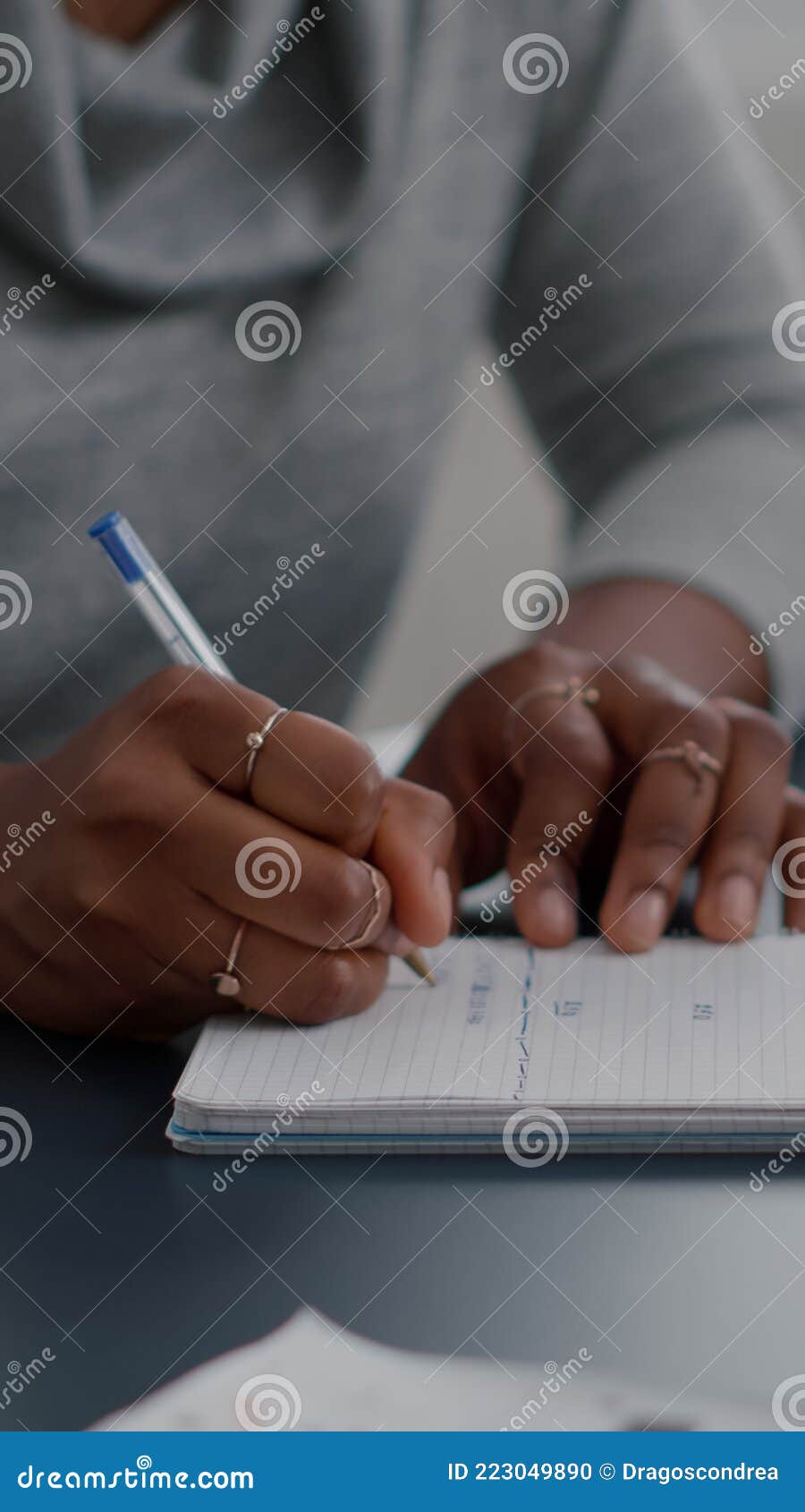 African American Student Writing High School Homework on Notebook ...