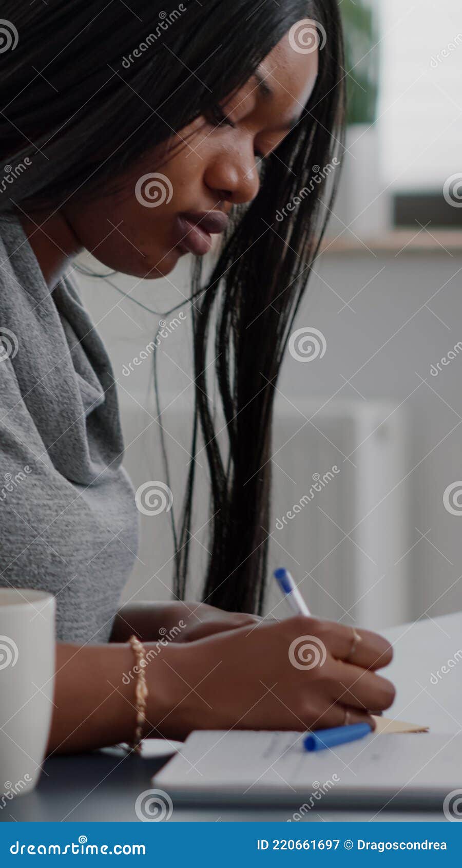 African American Student Writing Univeristy Information on Stickey ...