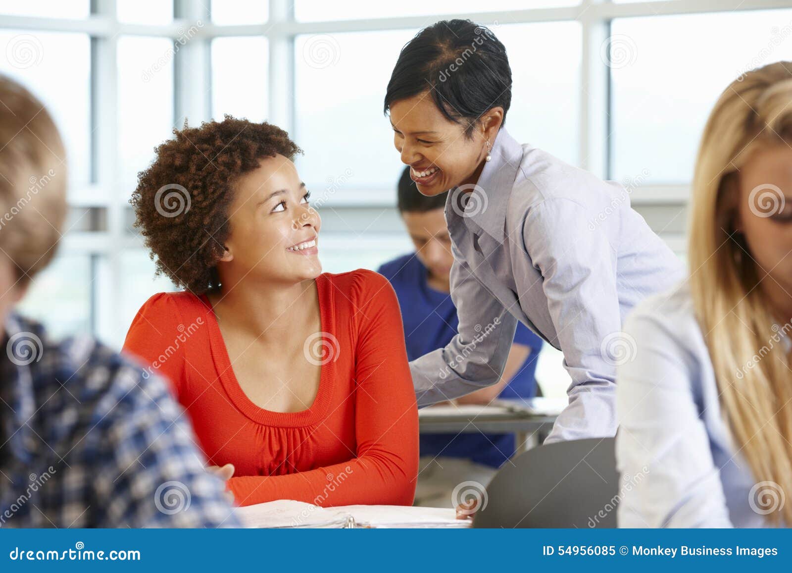 African American Teacher Helping Student in Class Stock Image - Image ...