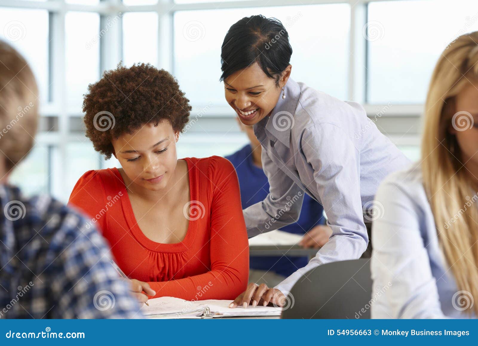 African American Teacher Helping Student in Class Stock Image - Image ...