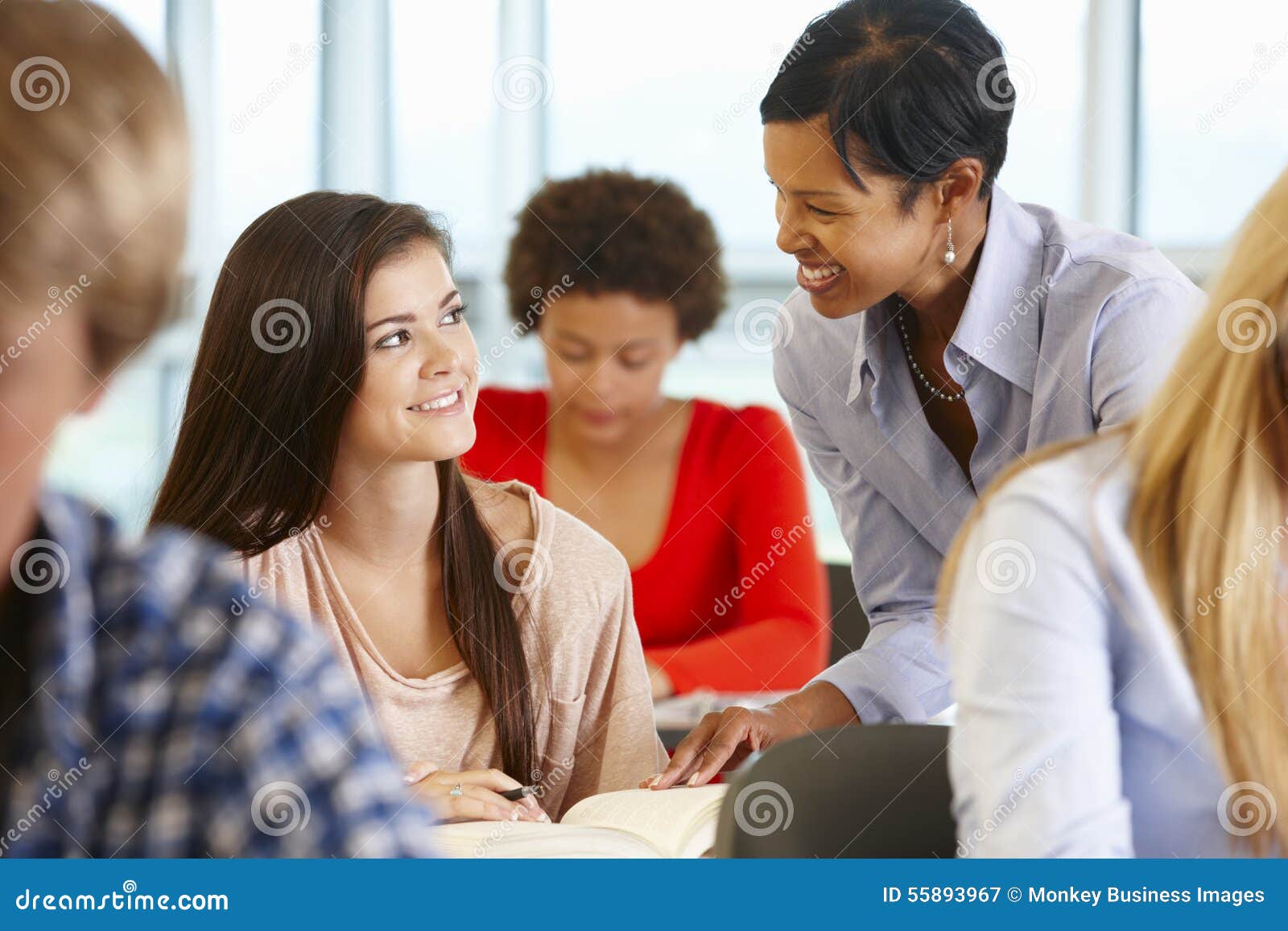 African American Teacher Helping Student in Class Stock Image - Image ...