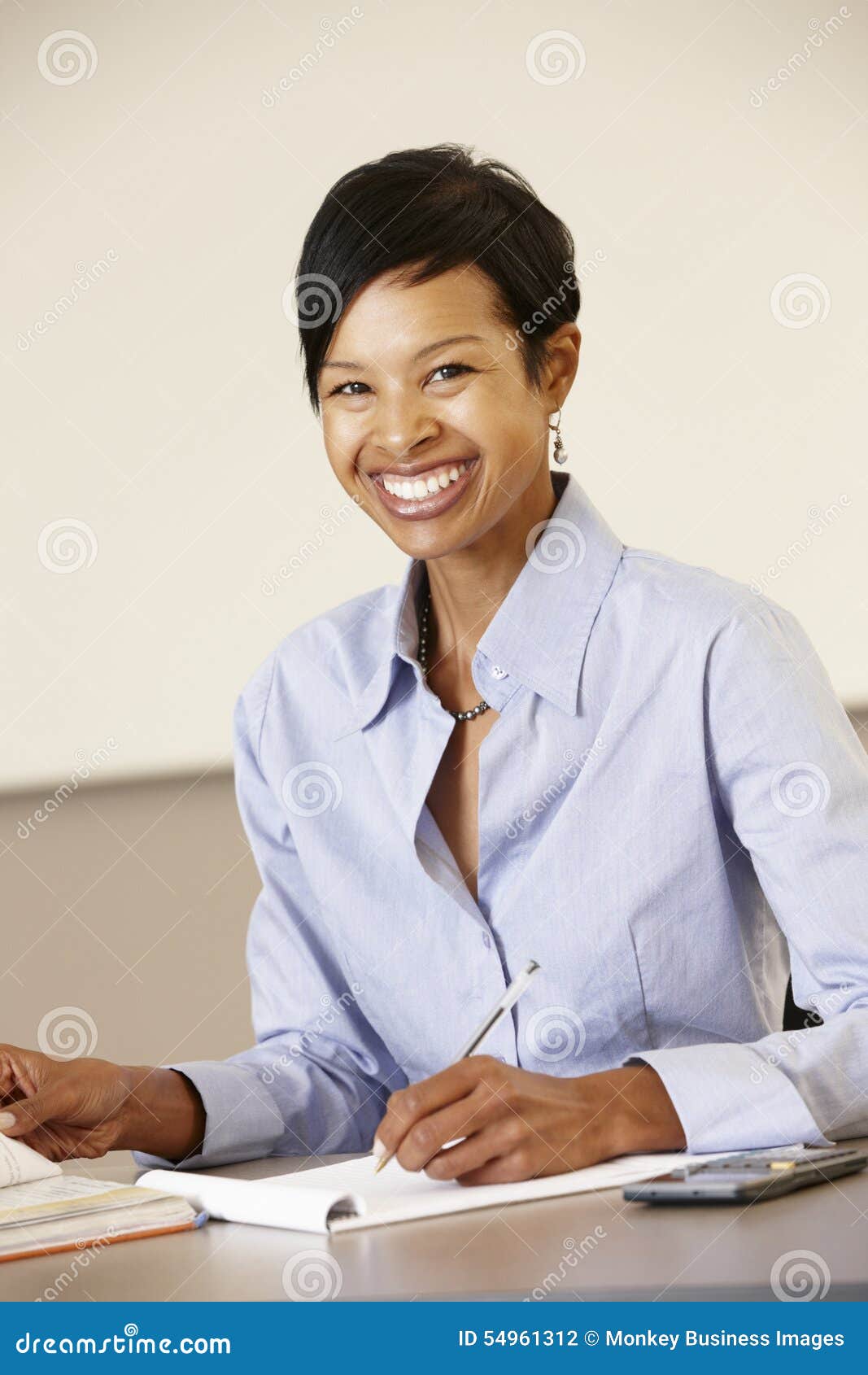 African American Teacher Working at Desk Stock Photo - Image of forties ...