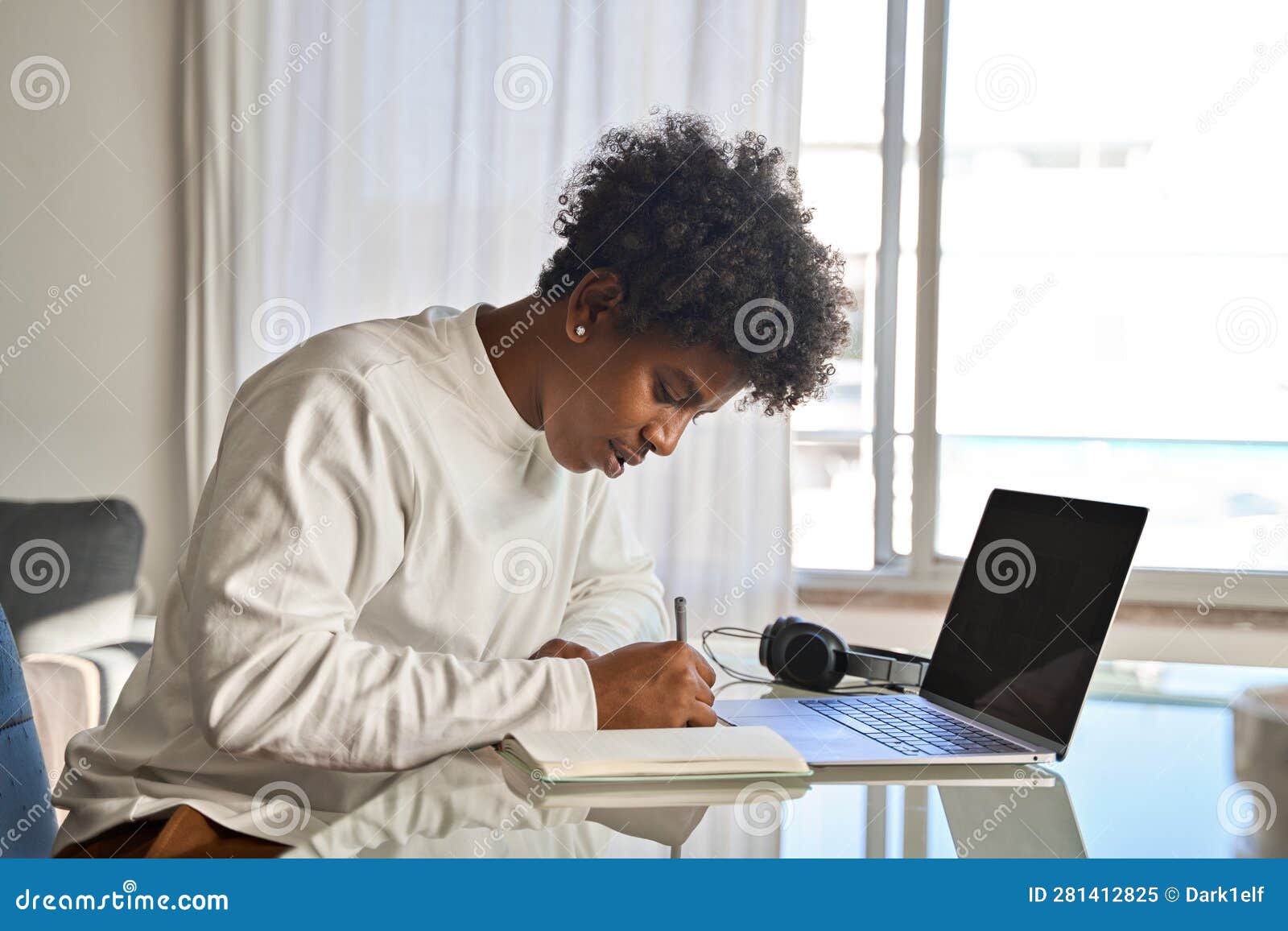 African American Teen Student Elearning, Writing Notes at Home. Stock ...