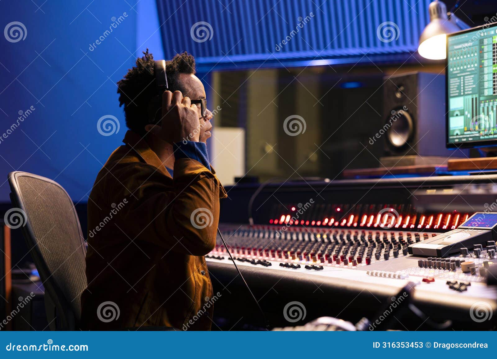 African American Tracking Engineer Processing and Editing Music in ...
