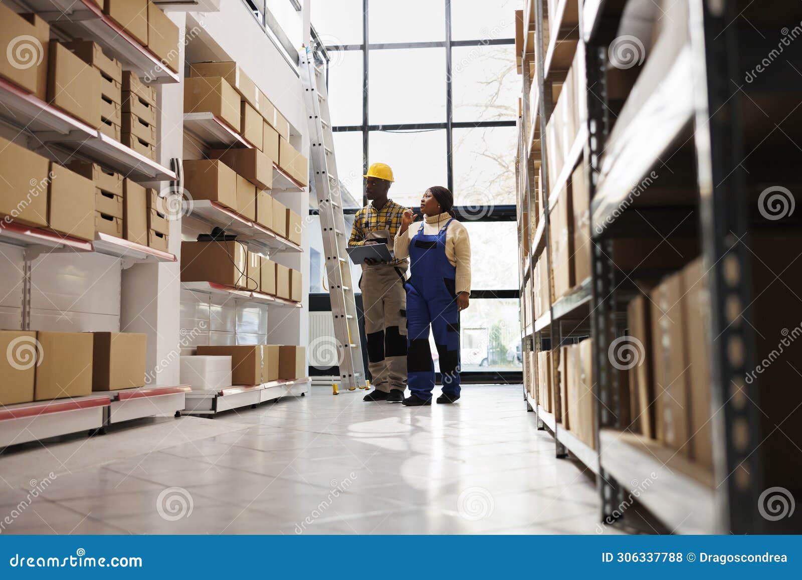 African American Warehouse Distribution Manager Doing Inventory with ...
