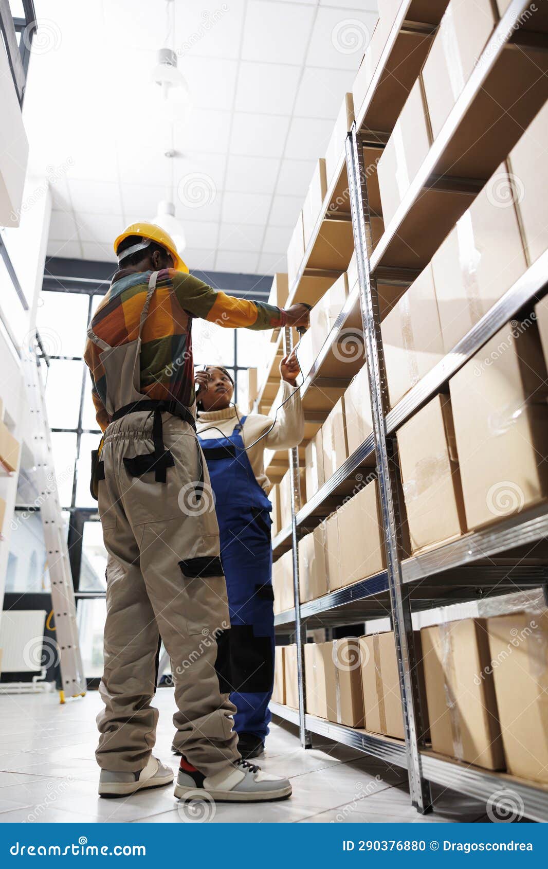 African American Warehouse Worker Scanning Parcel for Logistics Manager ...