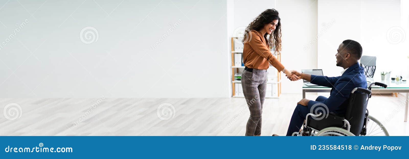 African American in Wheel Chair Shaking Stock Photo - Image of employee ...