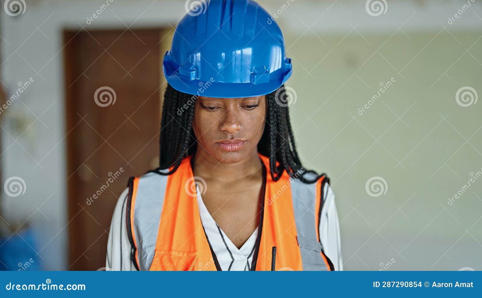 African American Woman Builder Standing with Relaxed Expression at ...