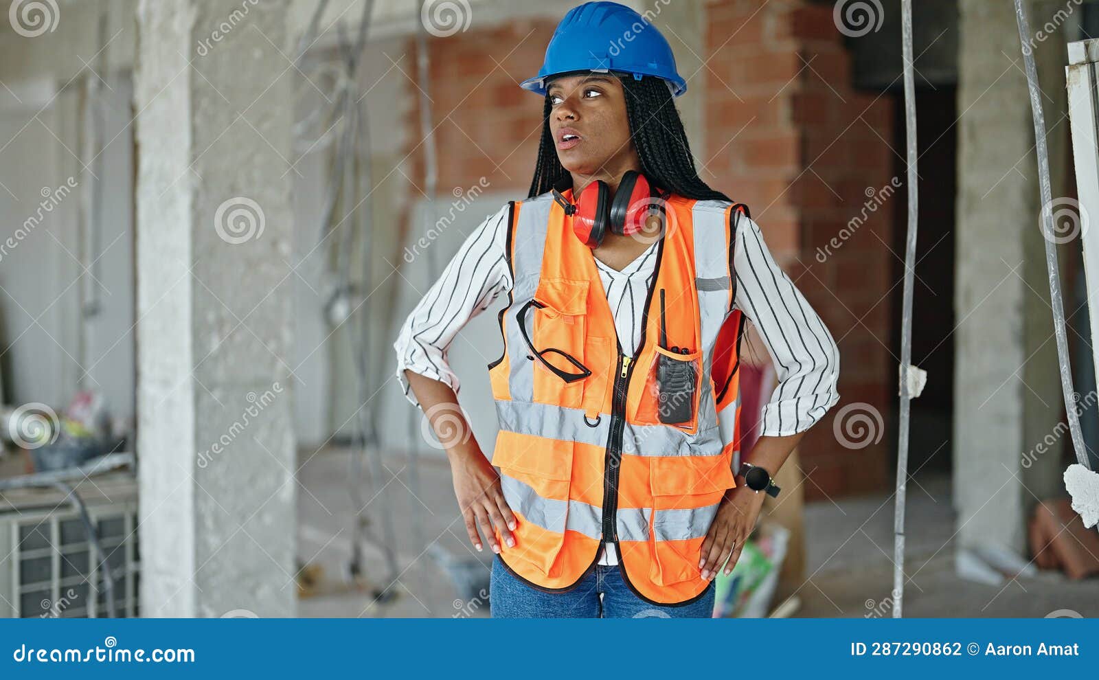 African American Woman Builder Standing with Relaxed Expression at ...